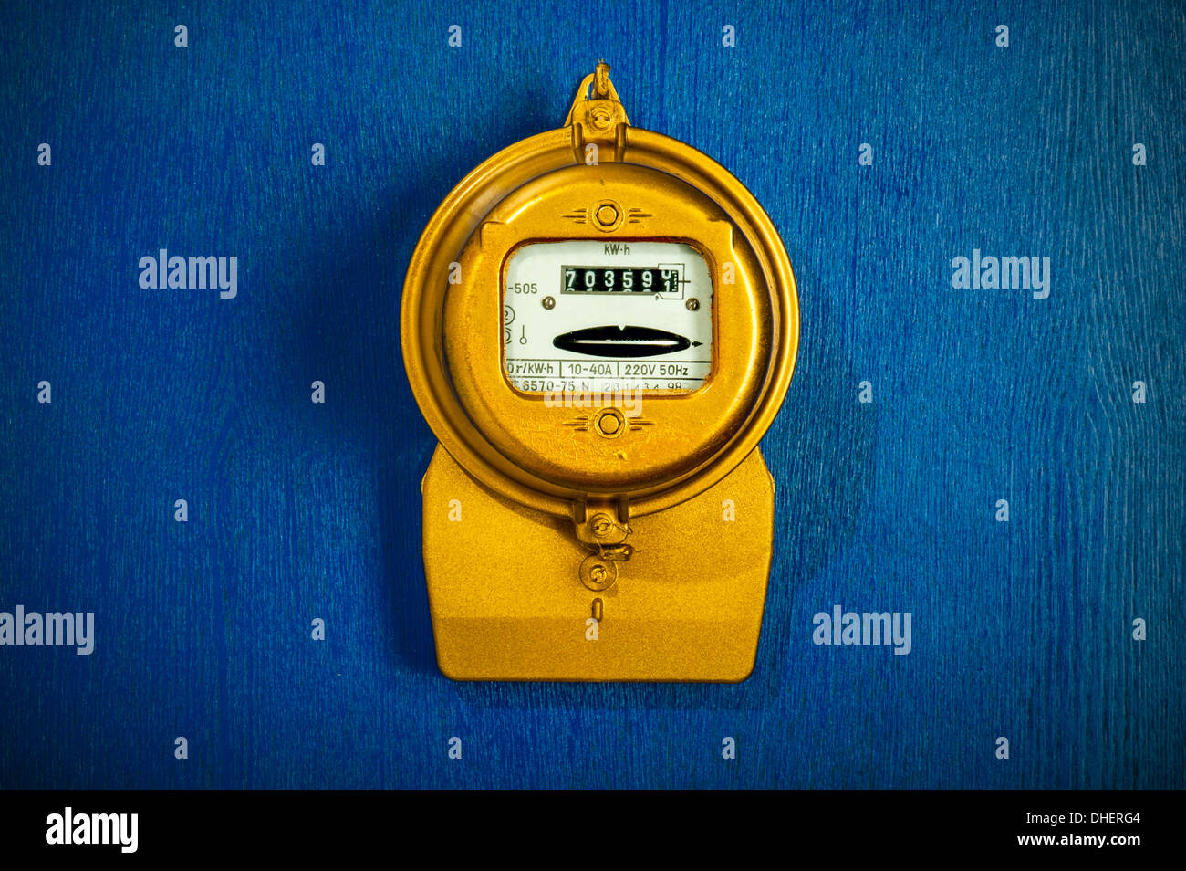object on blue - Golden retro electric meter Stock Photo - Alamy