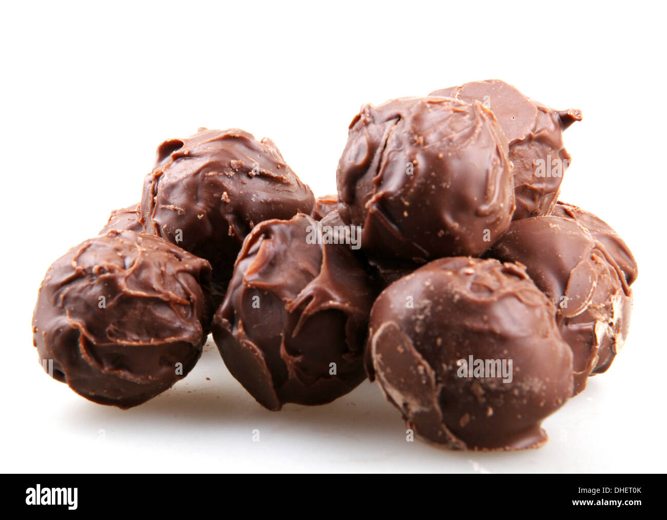 stacked chocolate candy on white background Stock Photo - Alamy
