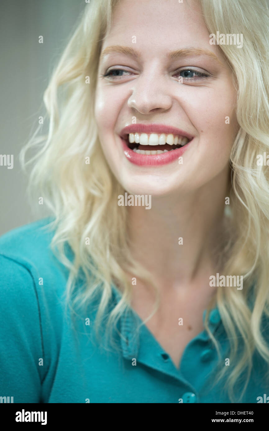 Young woman laughing Stock Photo - Alamy