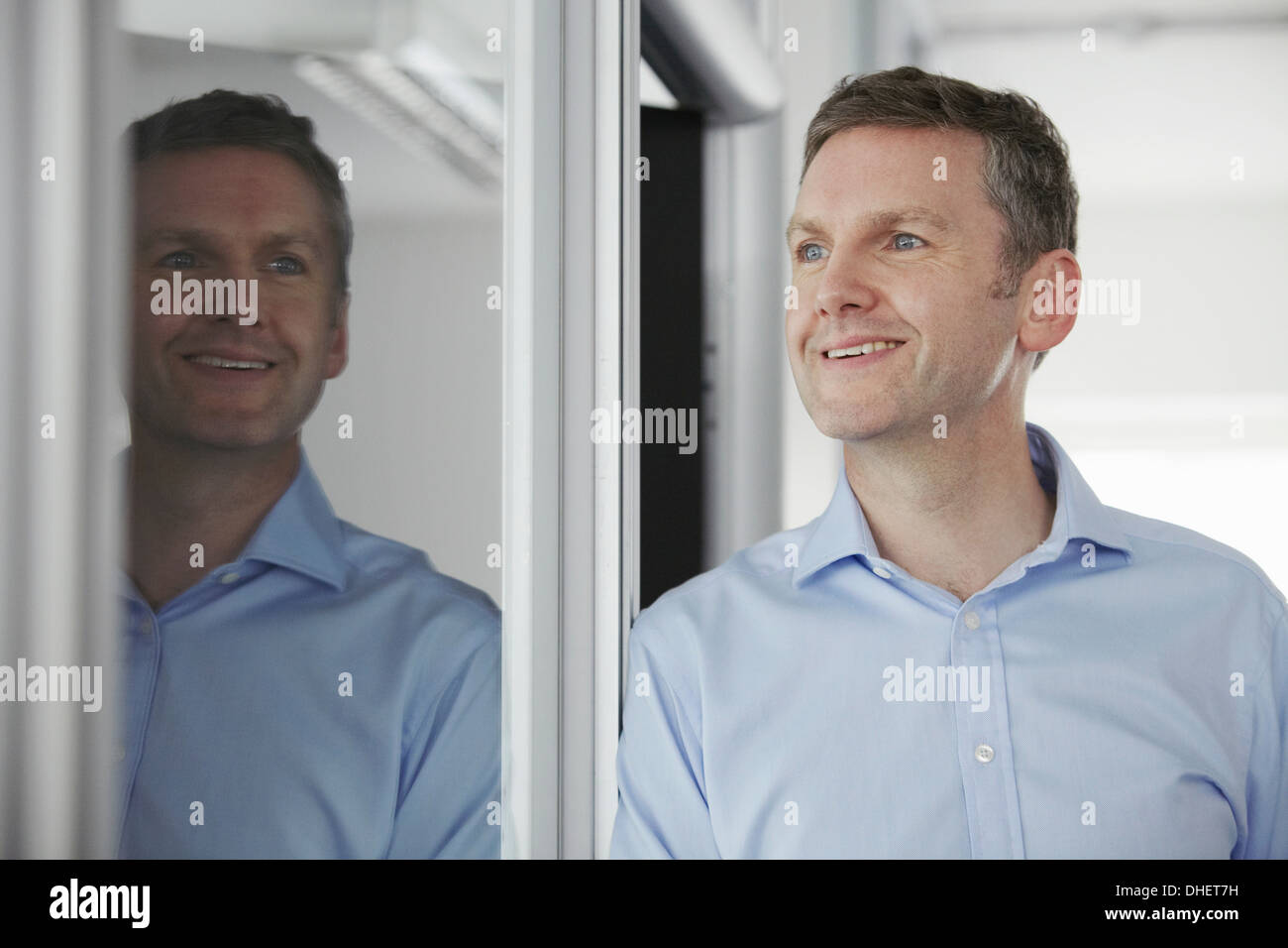 Man standing beside window reflection hi-res stock photography and ...