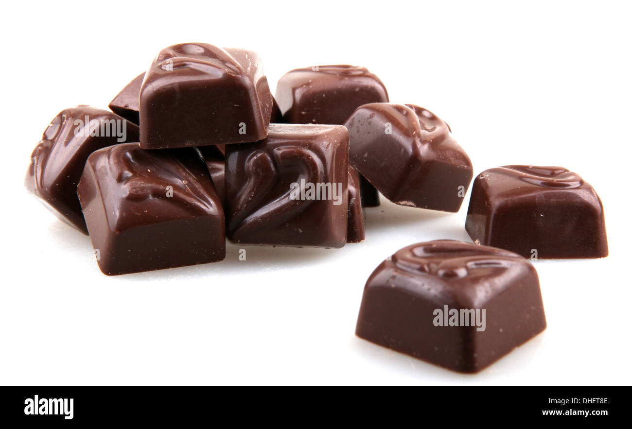 stacked chocolate candy on white background Stock Photo - Alamy