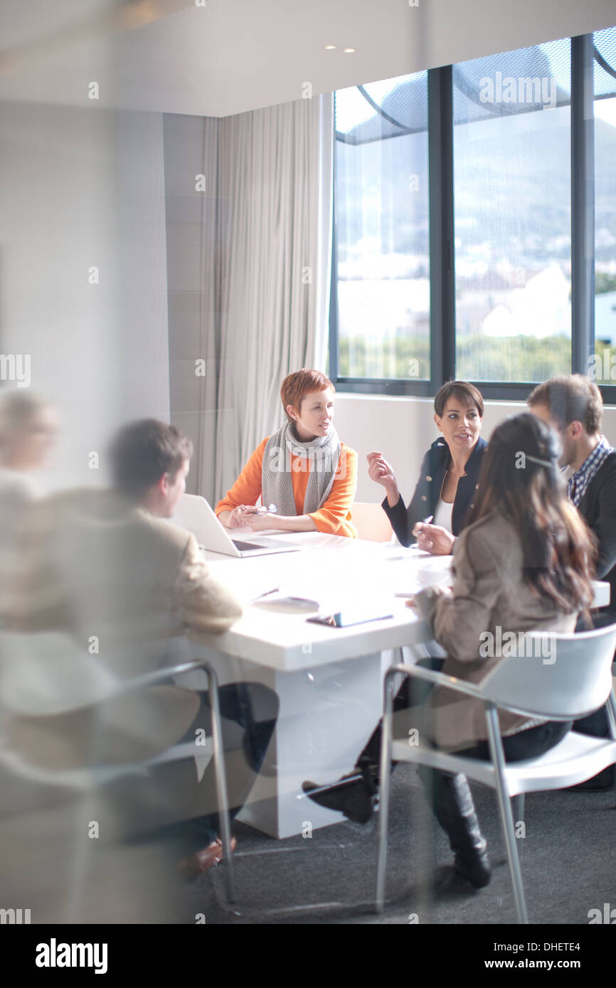 Businesspeople meeting around conference table Stock Photo - Alamy