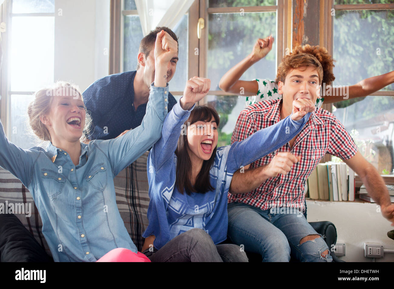Small group friends watching tv hi-res stock photography and images - Alamy