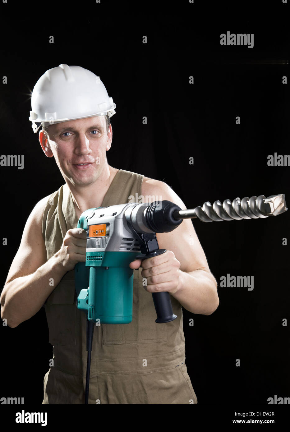 Construction industry worker holds helmet hi-res stock photography and ...