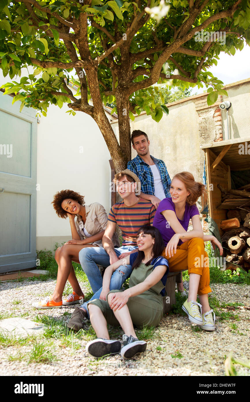 Group people sitting under tree hi-res stock photography and images - Alamy