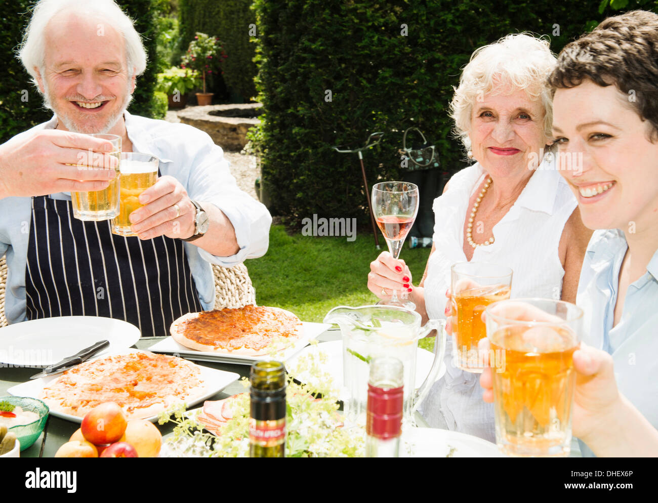 Group of people enjoying food and drink outdoors Stock Photo - Alamy