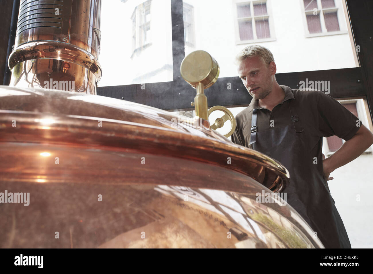 Man working at brewery Stock Photo - Alamy