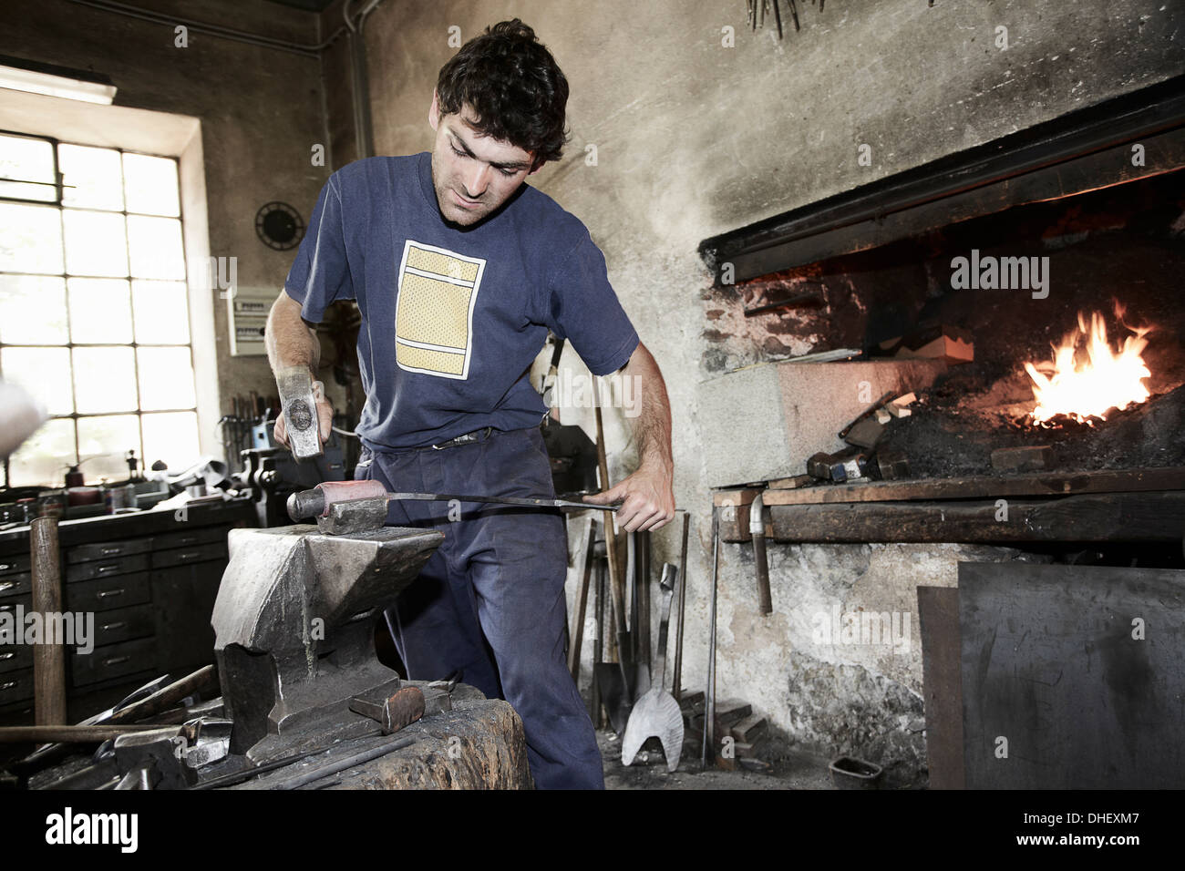 Blacksmith at work Stock Photo - Alamy