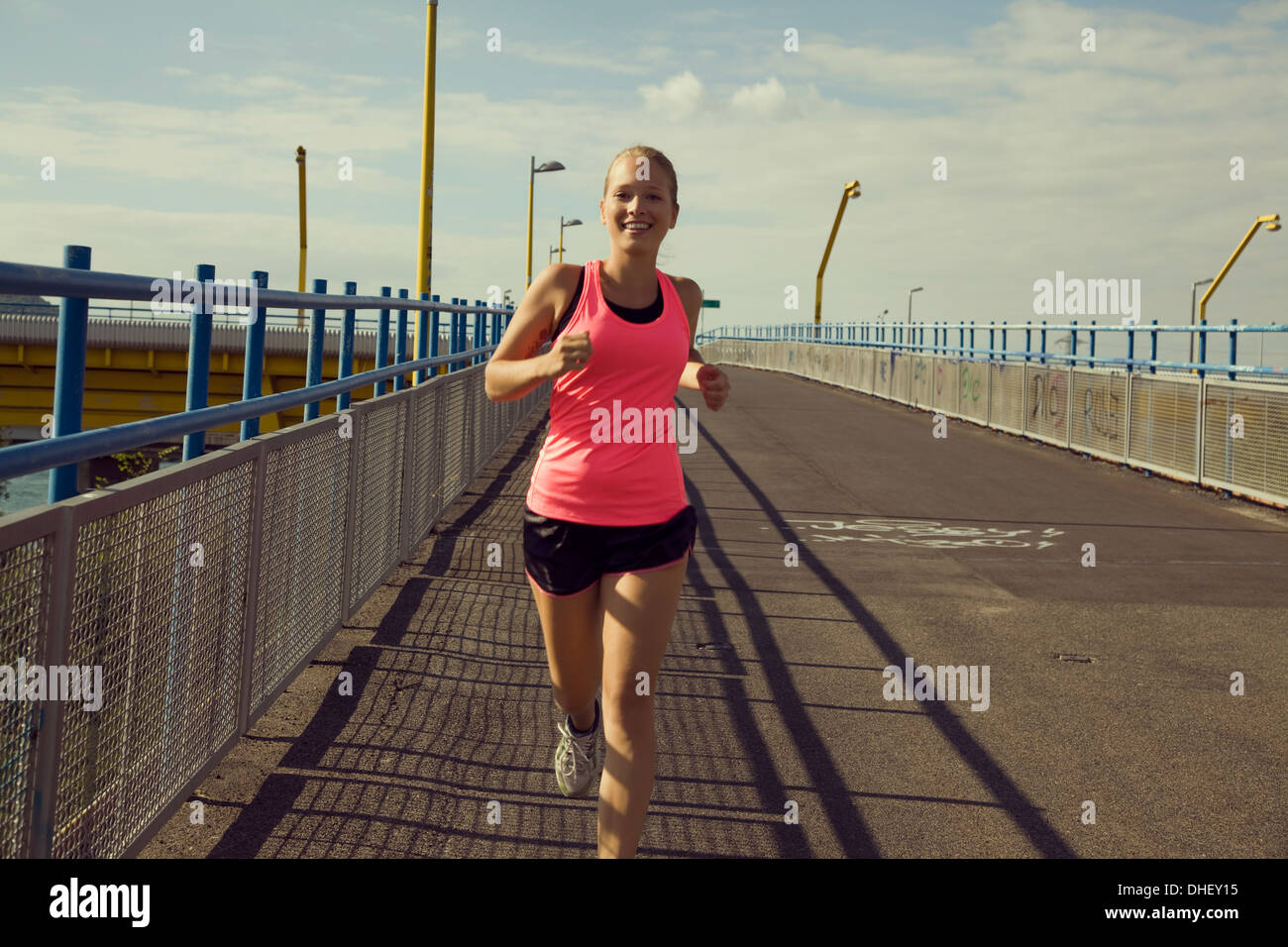 Female jogger bridge hi-res stock photography and images - Alamy
