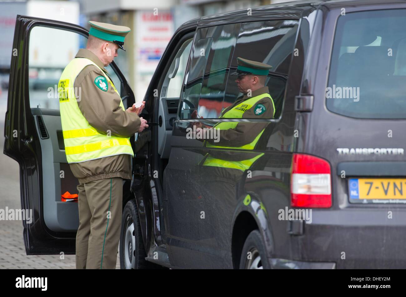 Swiecko, Poland. 08th Nov, 2013. A Polish border guard examines a ...