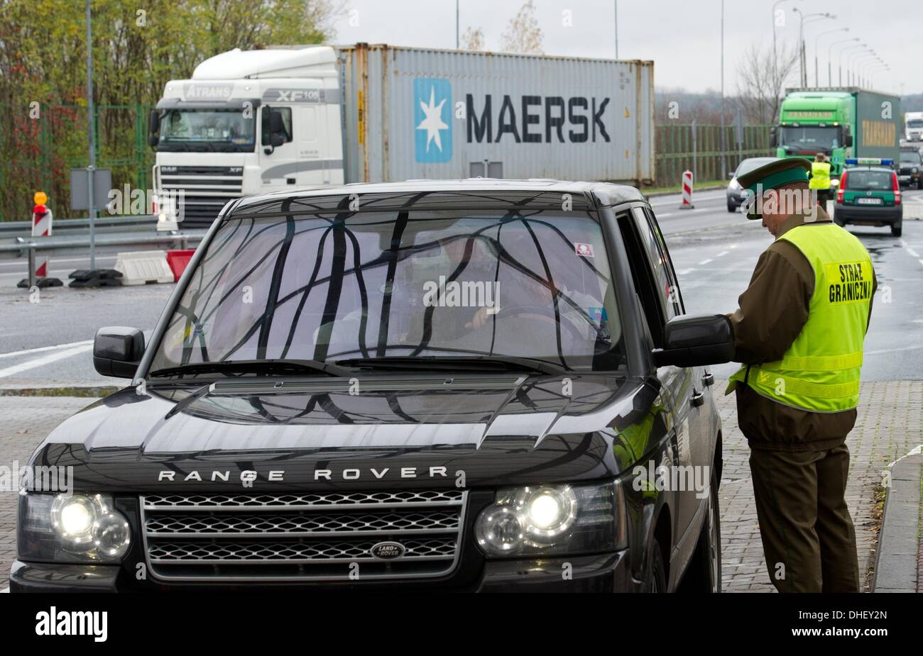 Swiecko, Poland. 08th Nov, 2013. A Polish border guard examines a ...