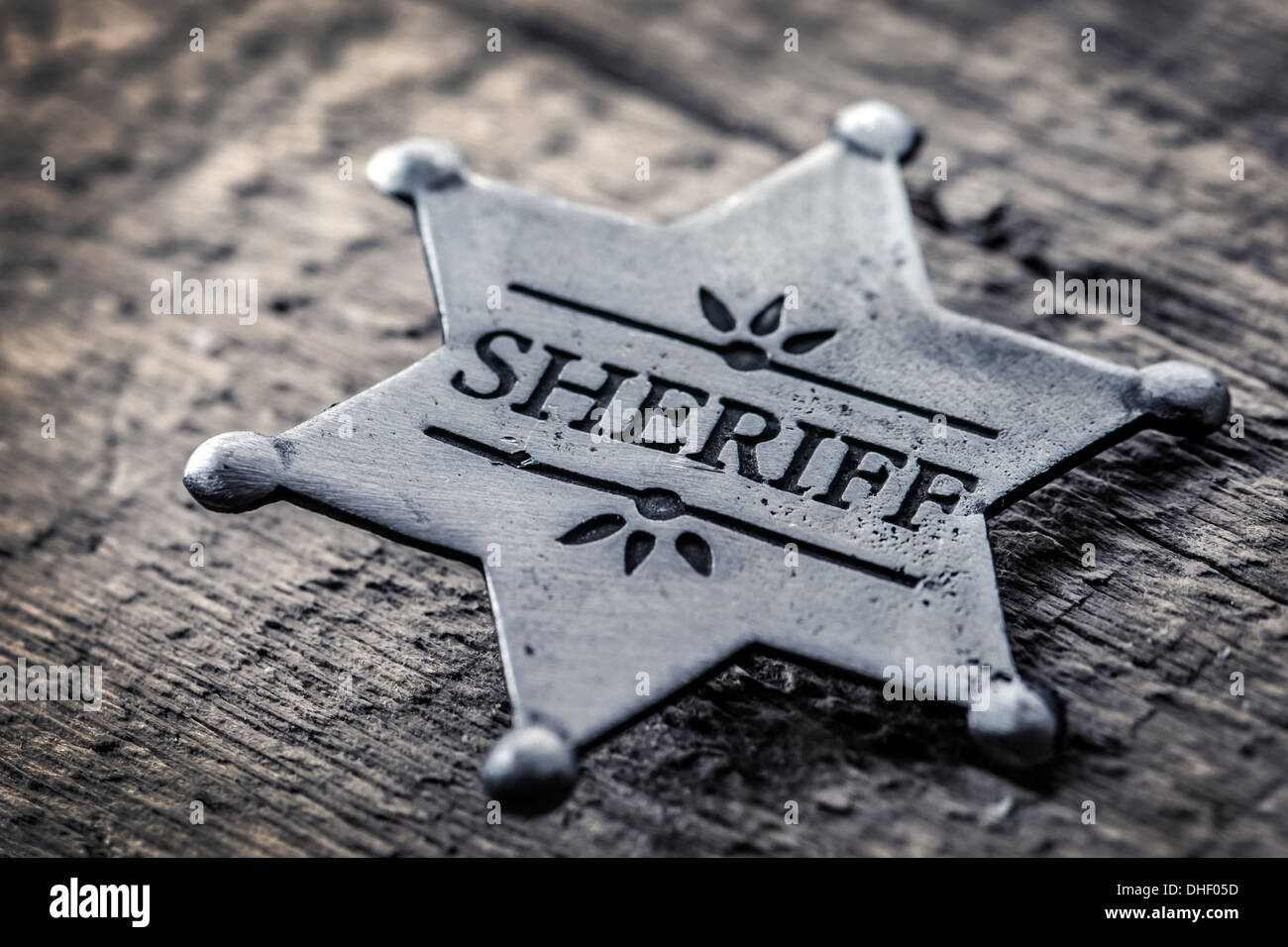 sheriff star isolated on black Stock Photo - Alamy