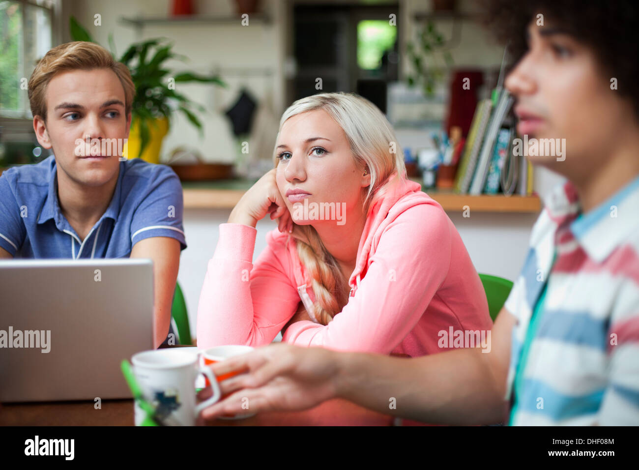 Three people sitting around hi-res stock photography and images - Alamy