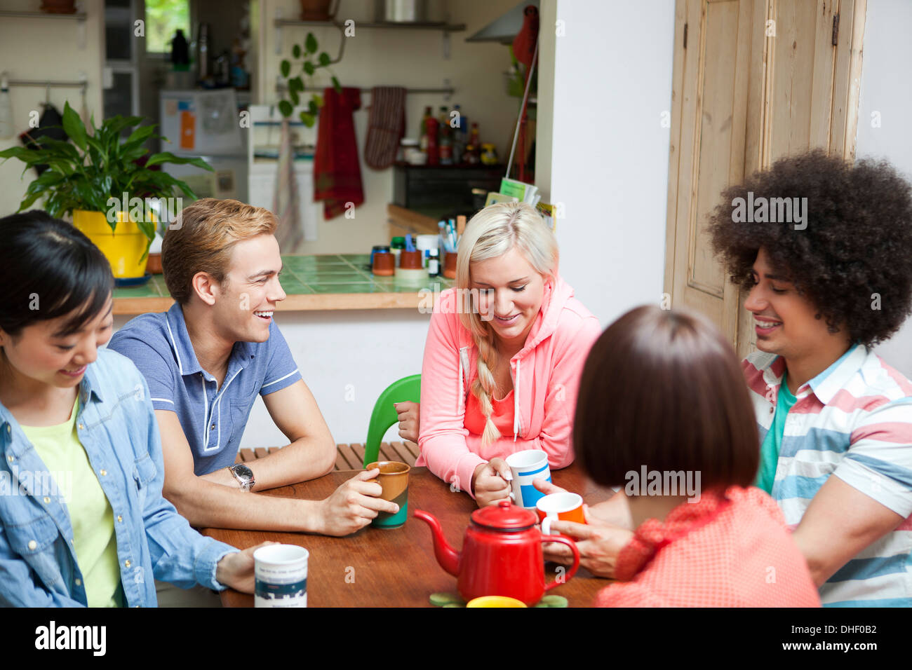 Group people sitting around table hi-res stock photography and images ...
