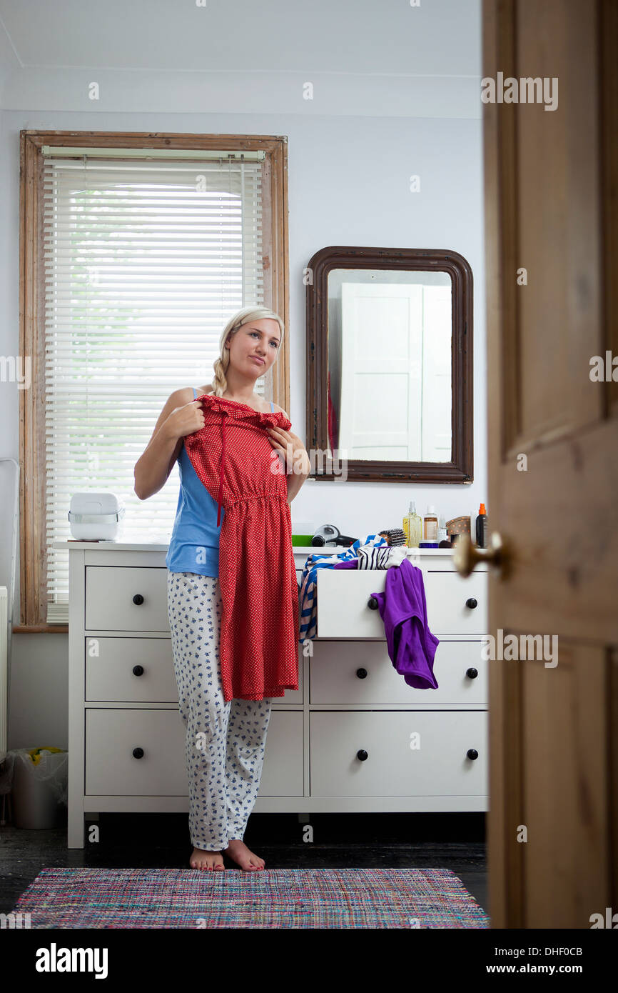 Woman getting dressed hi-res stock photography and images - Alamy
