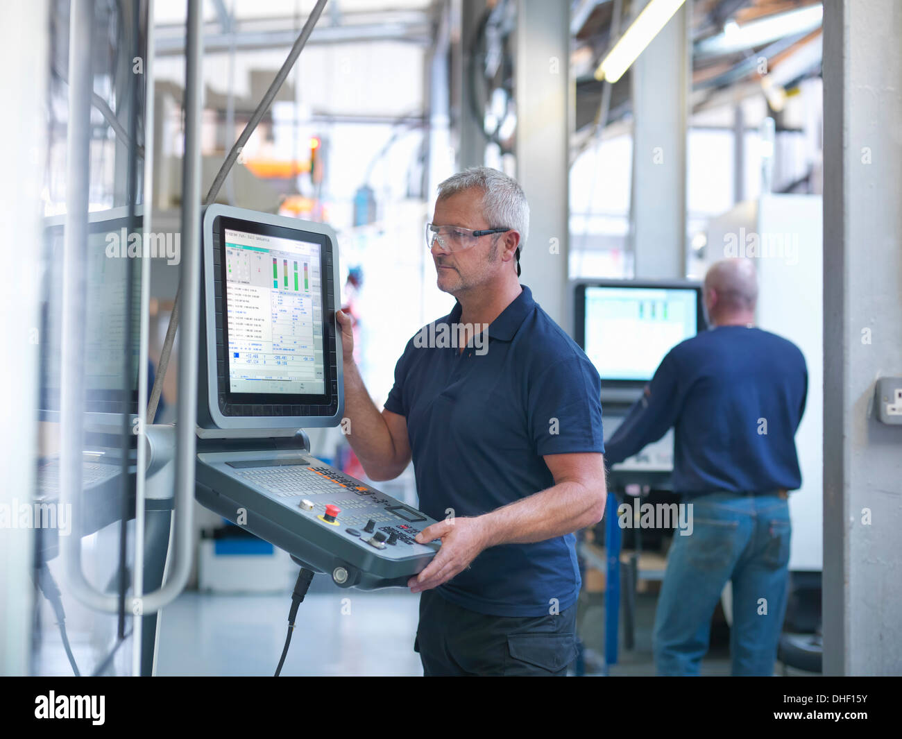 Two engineers looking at computer hi-res stock photography and images ...
