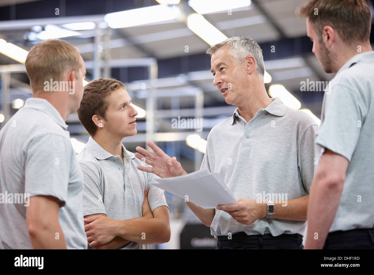 Manager and workers meeting in engineering factory Stock Photo - Alamy