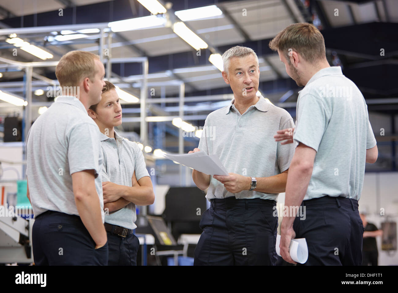 Workers meeting in engineering factory Stock Photo - Alamy