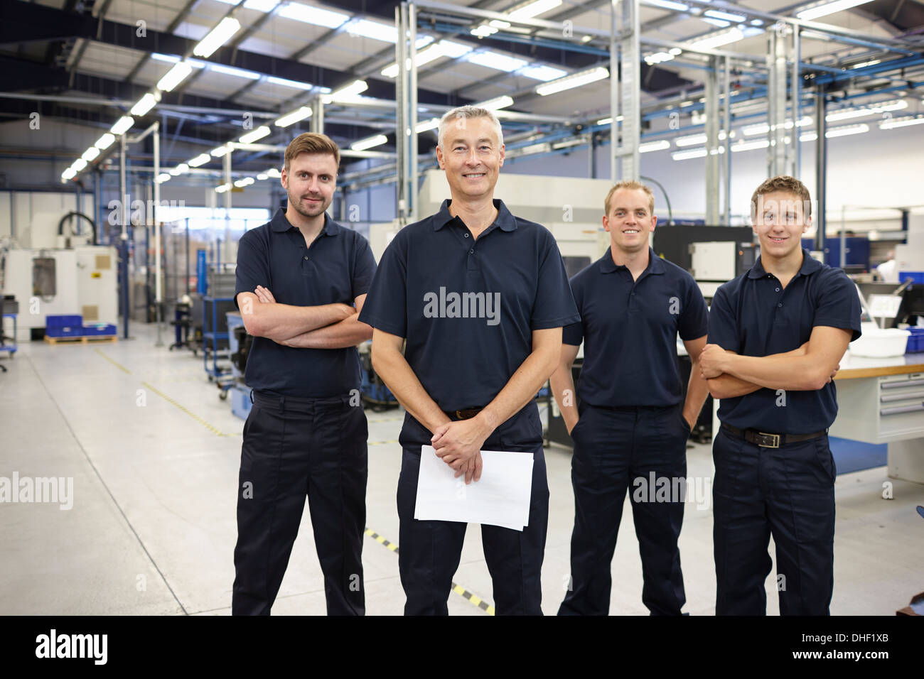 Portrait warehouse team standing arms hi-res stock photography and ...