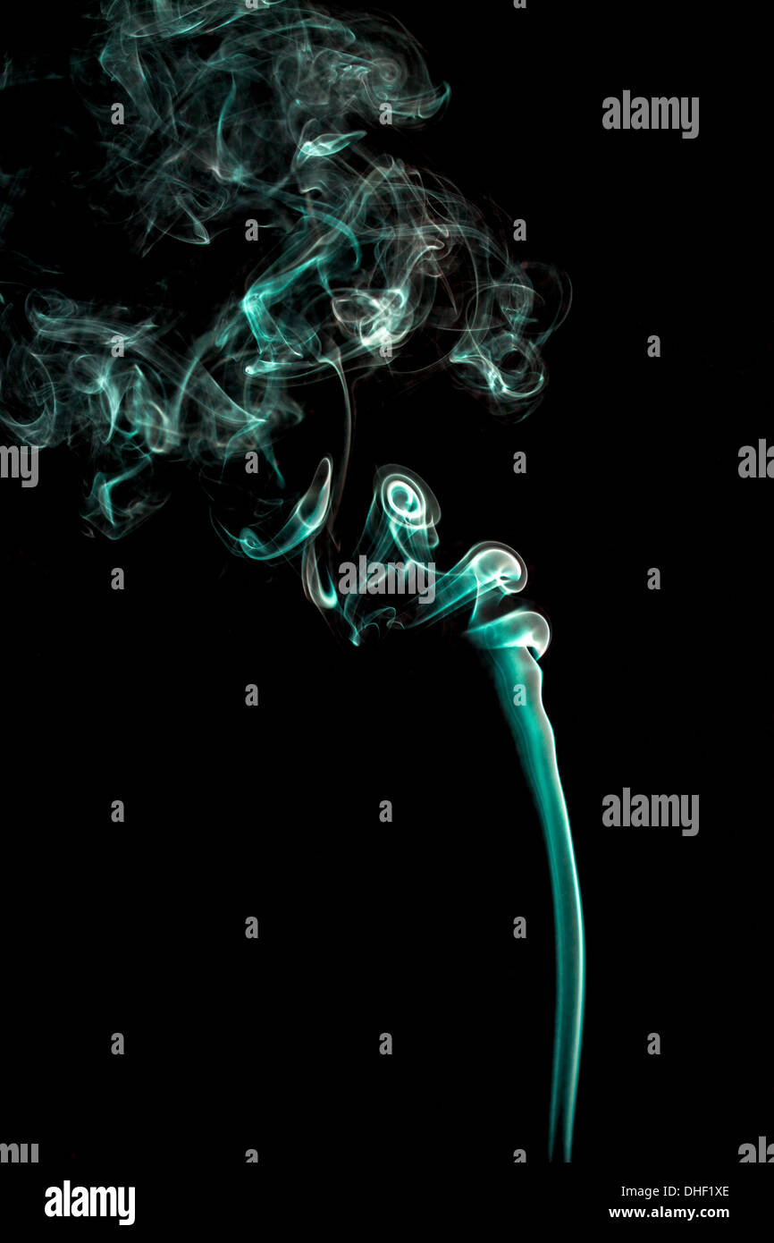 Abstract green fuzzy line of smoke on black background Stock Photo - Alamy