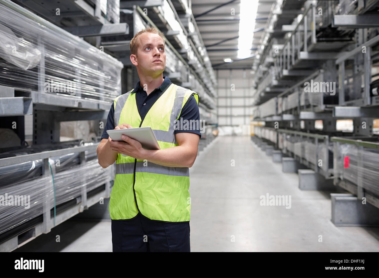 Worker checking order in engineering warehouse Stock Photo - Alamy
