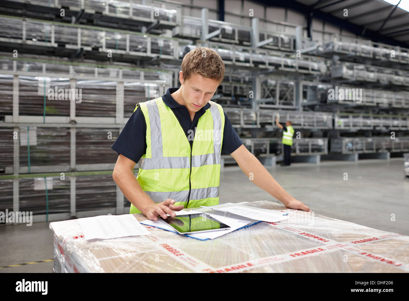 Warehouse worker preparing order in engineering warehouse Stock Photo ...