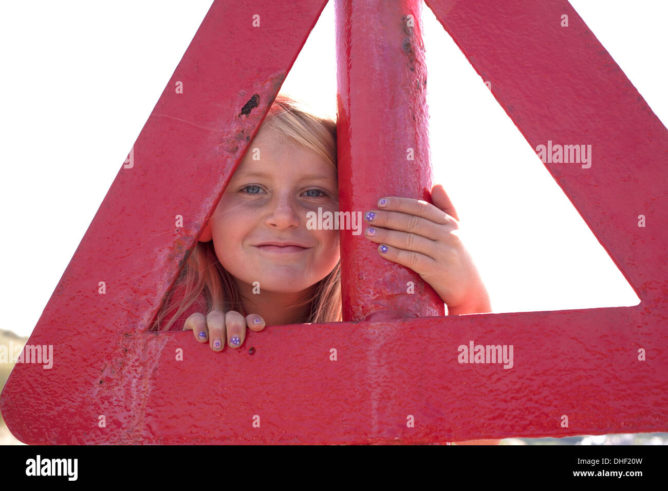 Portrait of girl looking through red triangle, Wales, UK Stock Photo ...