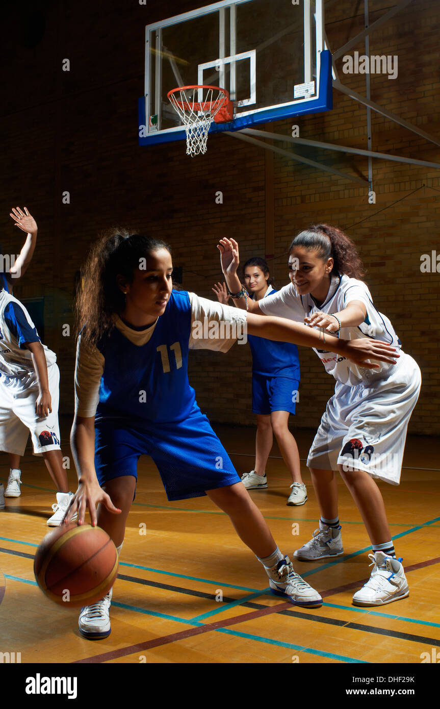 Basketball player defending opponent Stock Photo - Alamy