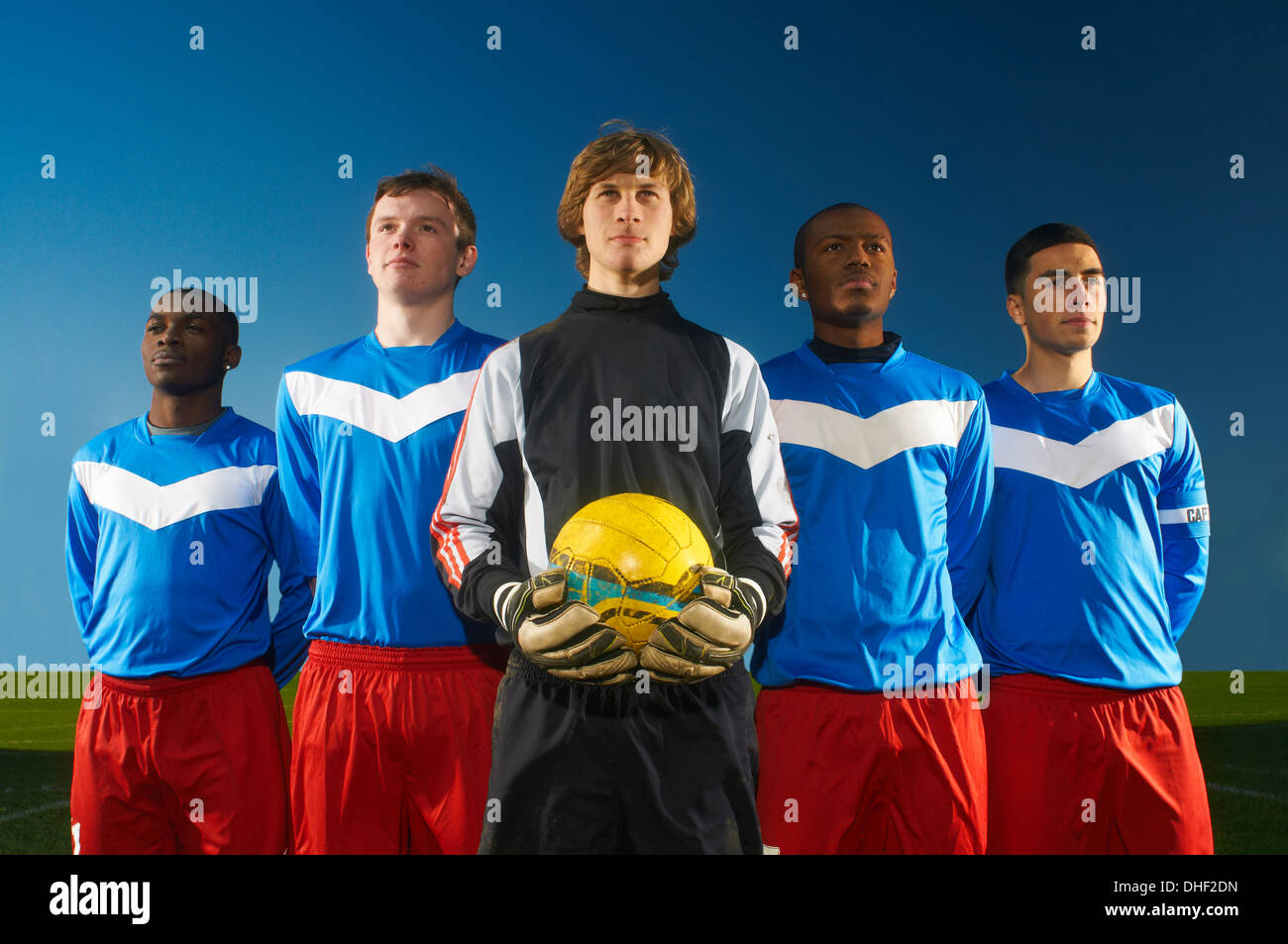 Portrait of football team, goalkeeper holding ball Stock Photo - Alamy