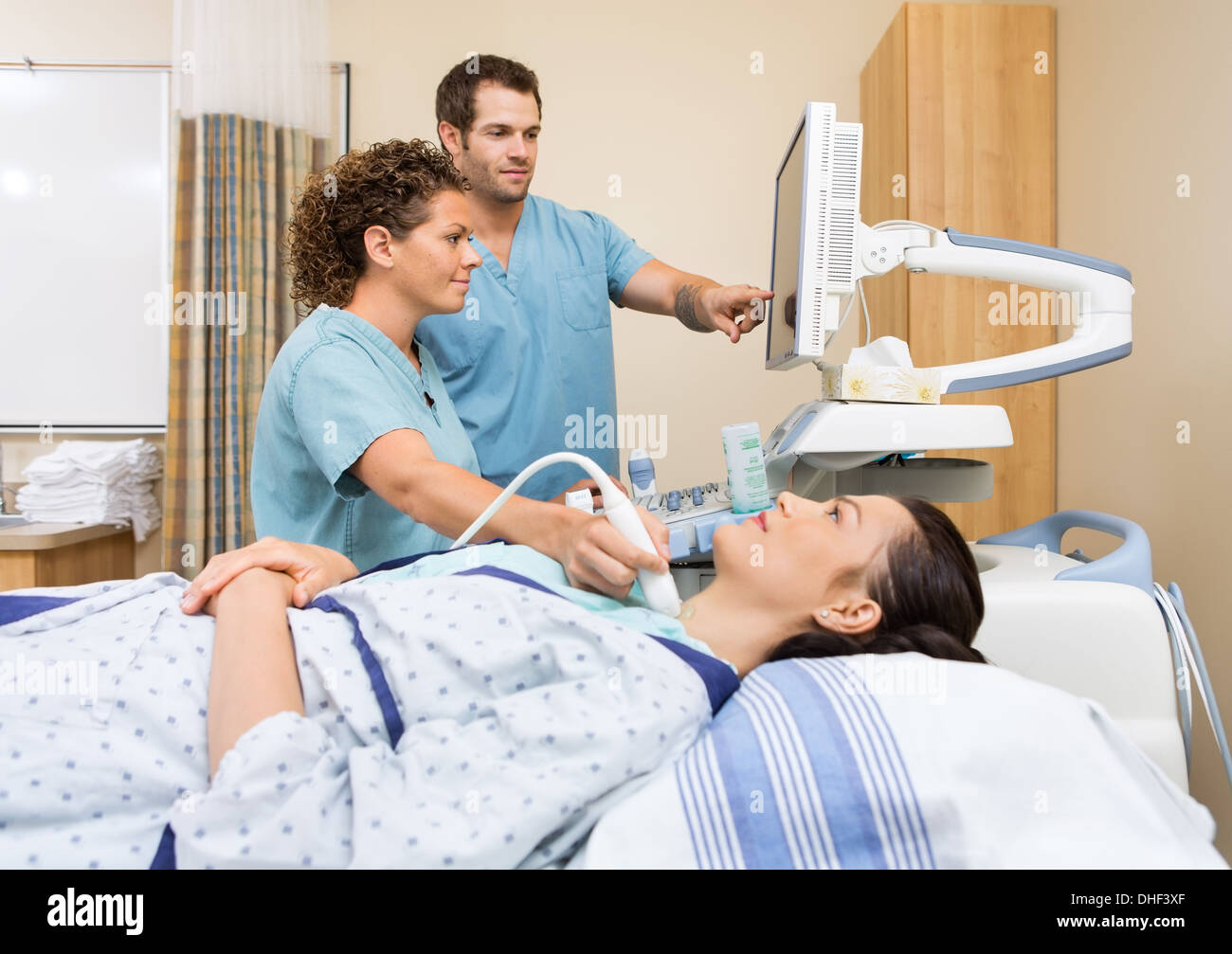 Nurses Performing Ultrasound Procedure Stock Photo - Alamy