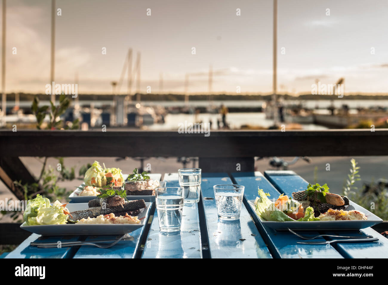 Table set with meals by marina, Reykjavik, Iceland Stock Photo - Alamy