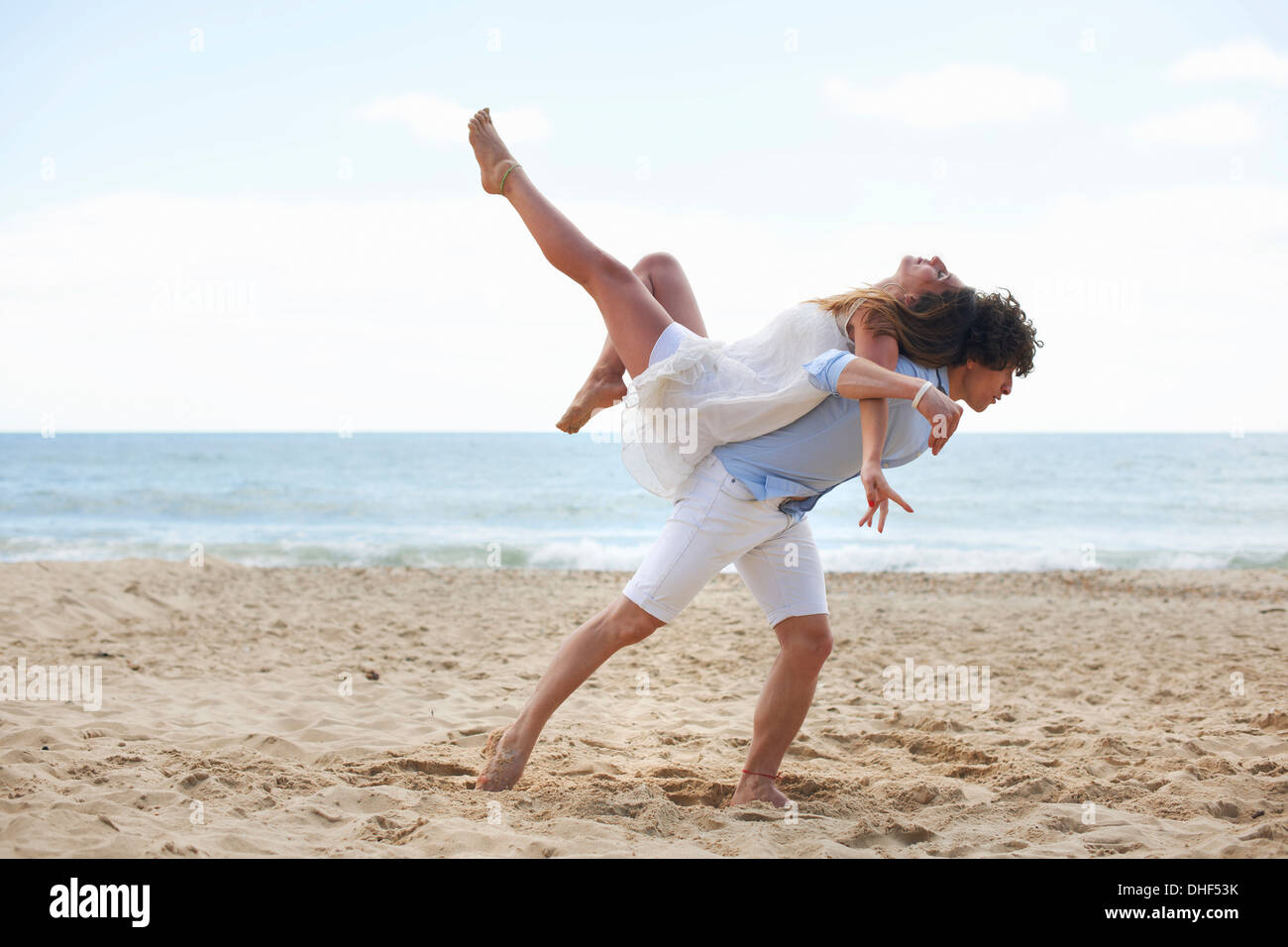 Couple tangoing on beach Stock Photo - Alamy