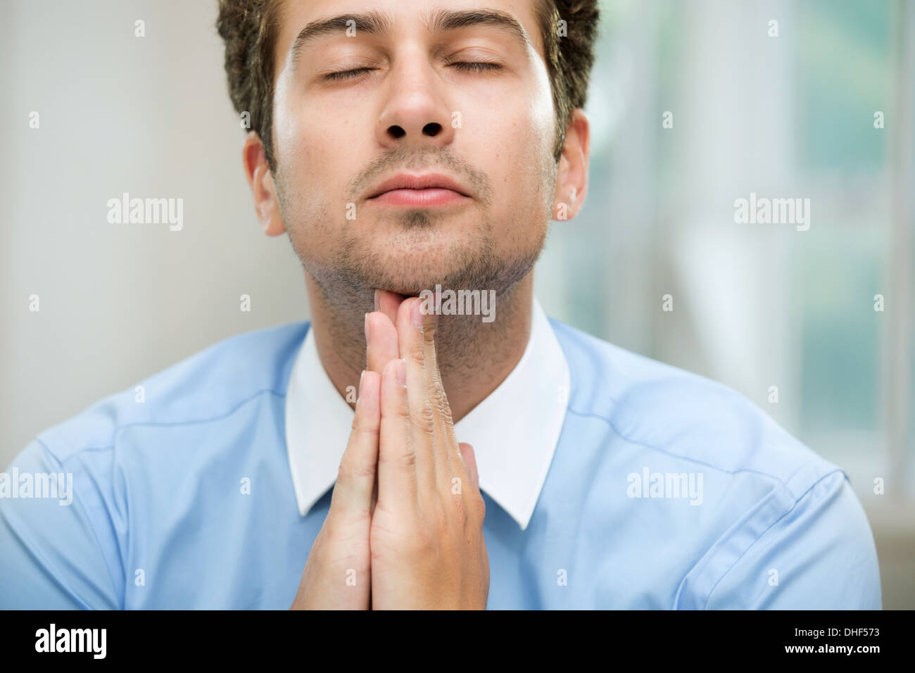 Young man in contemplation Stock Photo - Alamy