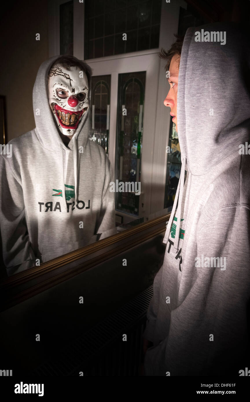 Teenager halloween mask grotesque clown hi-res stock photography and ...