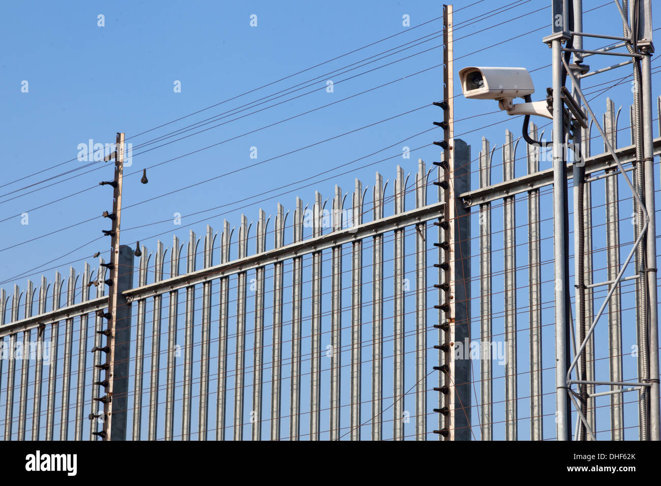Fence and surveillance video camera Stock Photo - Alamy