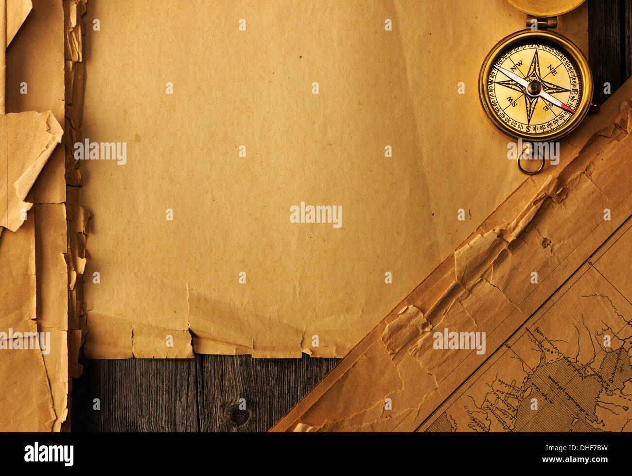 Antique compass over old map Stock Photo - Alamy