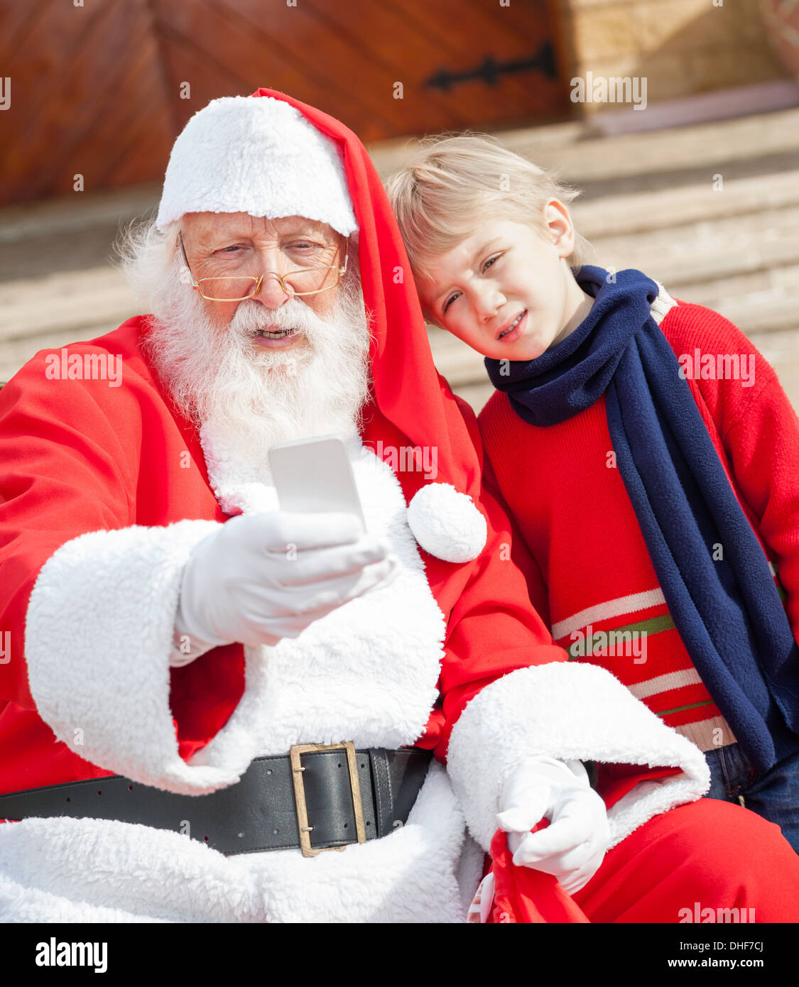 Santa Claus And Boy Taking Selfportrait Through Smartphone Stock Photo ...