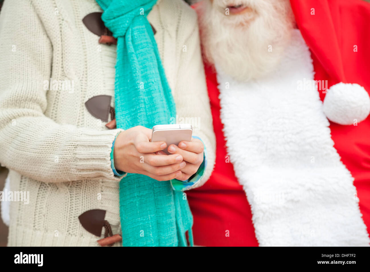 Santa claus showing mobile phone hi-res stock photography and images ...