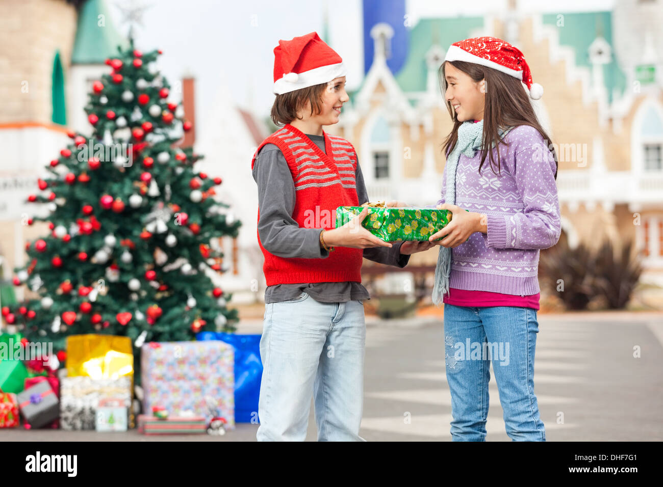 Boy Giving Present To Girl Stock Photo - Alamy