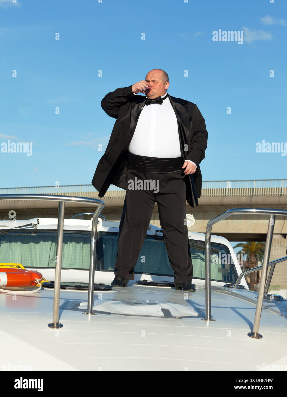 Fat man in tuxedo with glass wine Stock Photo - Alamy