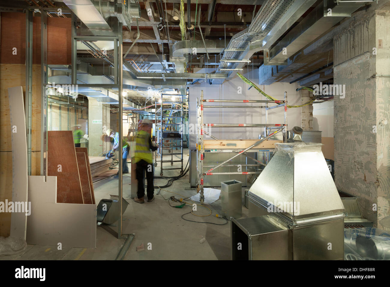 Builders working inside a construction site Stock Photo - Alamy