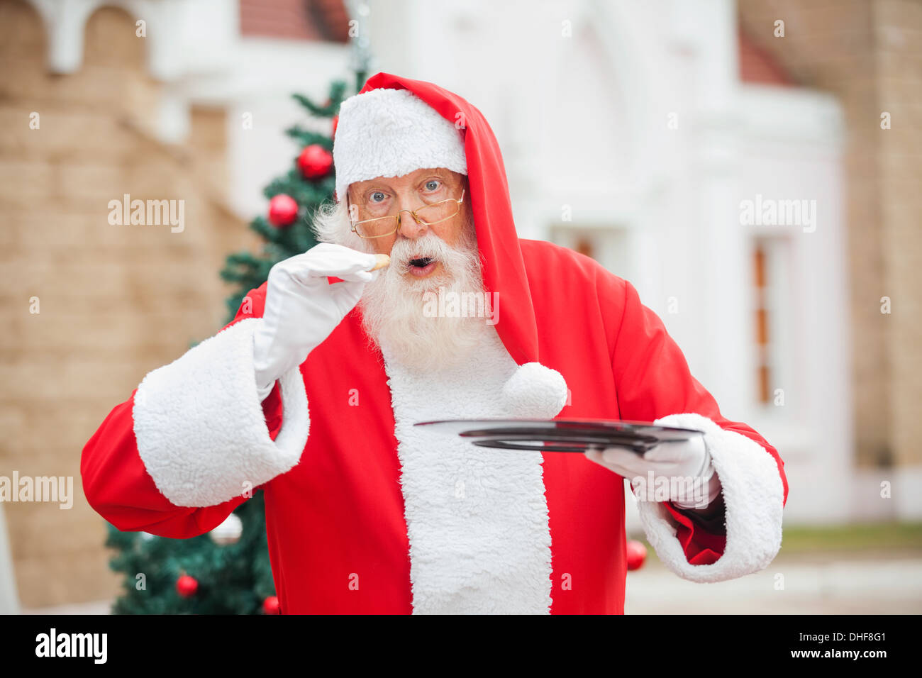 Santa claus eating cookies hi-res stock photography and images - Alamy