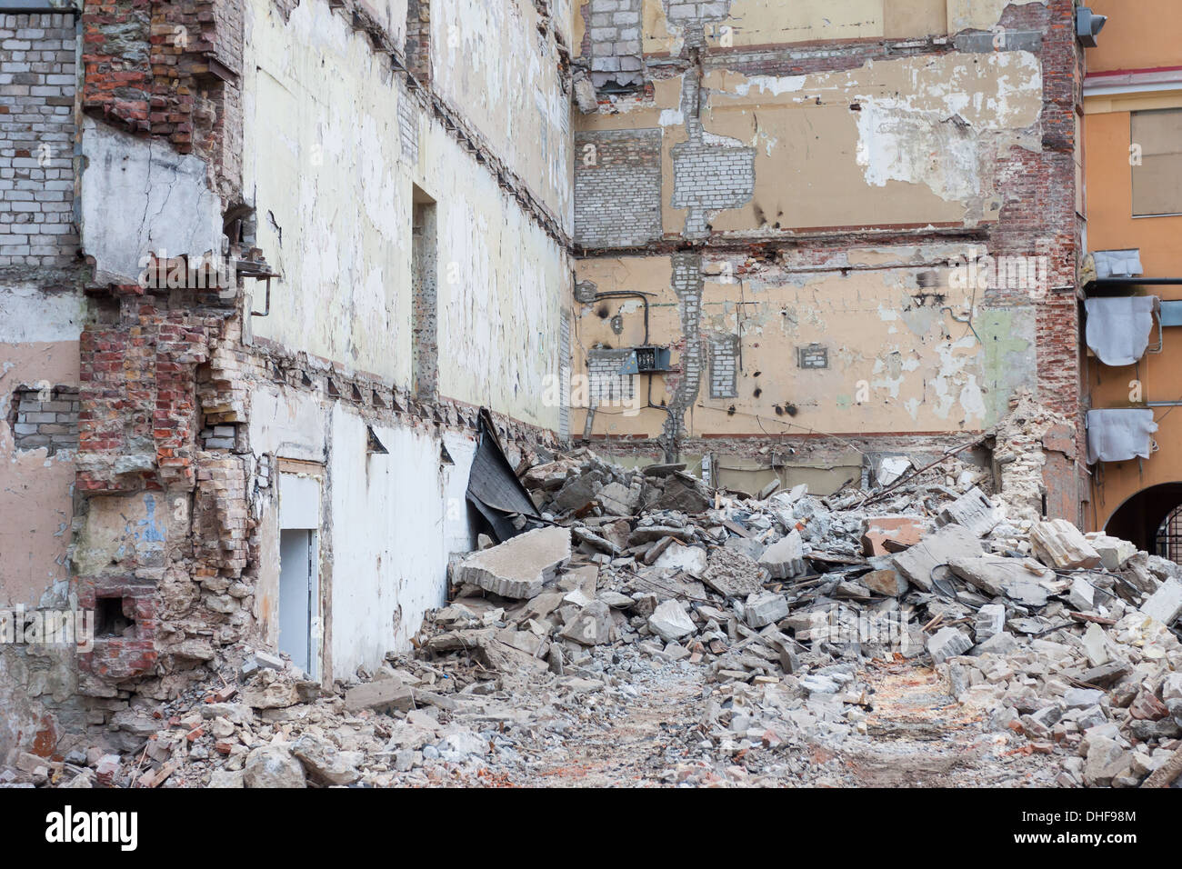 heap of rubble and a demolished building in the background Stock Photo ...