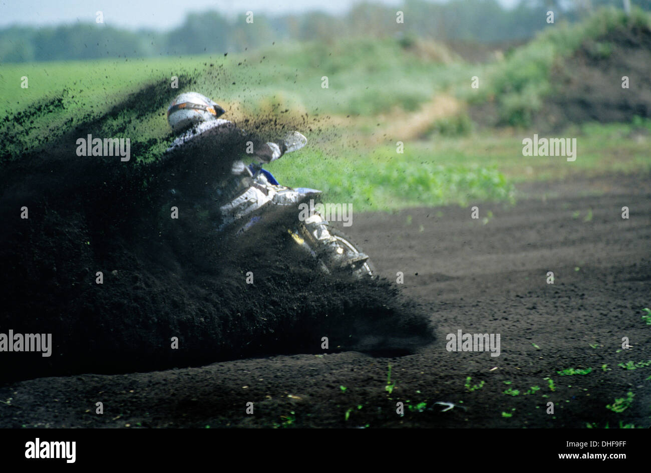 Motorcycle racing sliding his bike in dirt Stock Photo - Alamy
