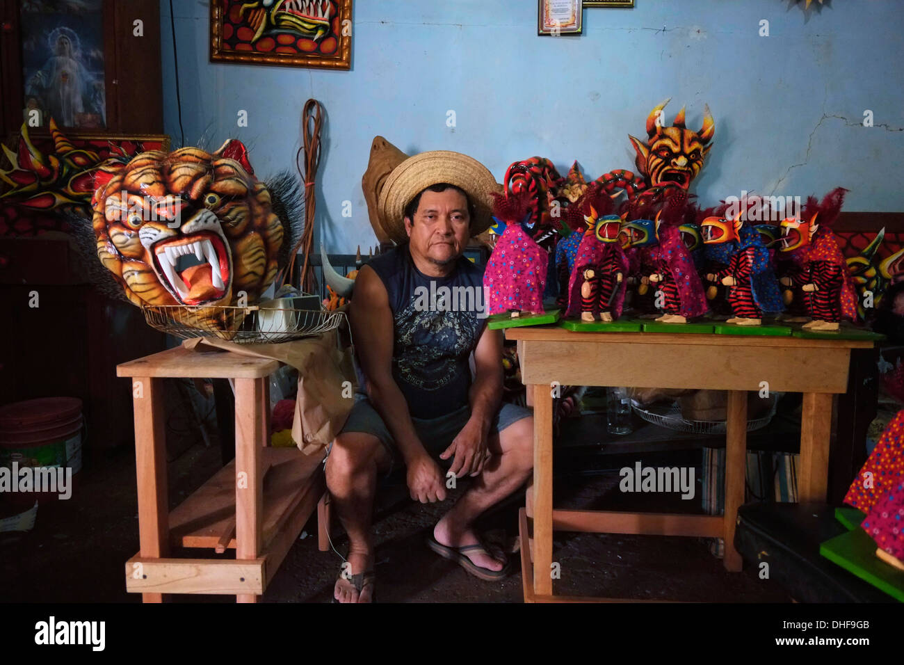 A traditional devil mask maker in his workshop in Villa de los Santos ...