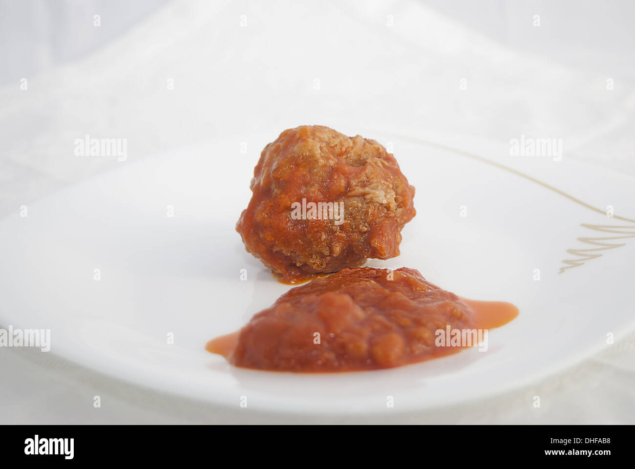 Italian recipe: rissole of mincemeat with tomato sauce Stock Photo - Alamy