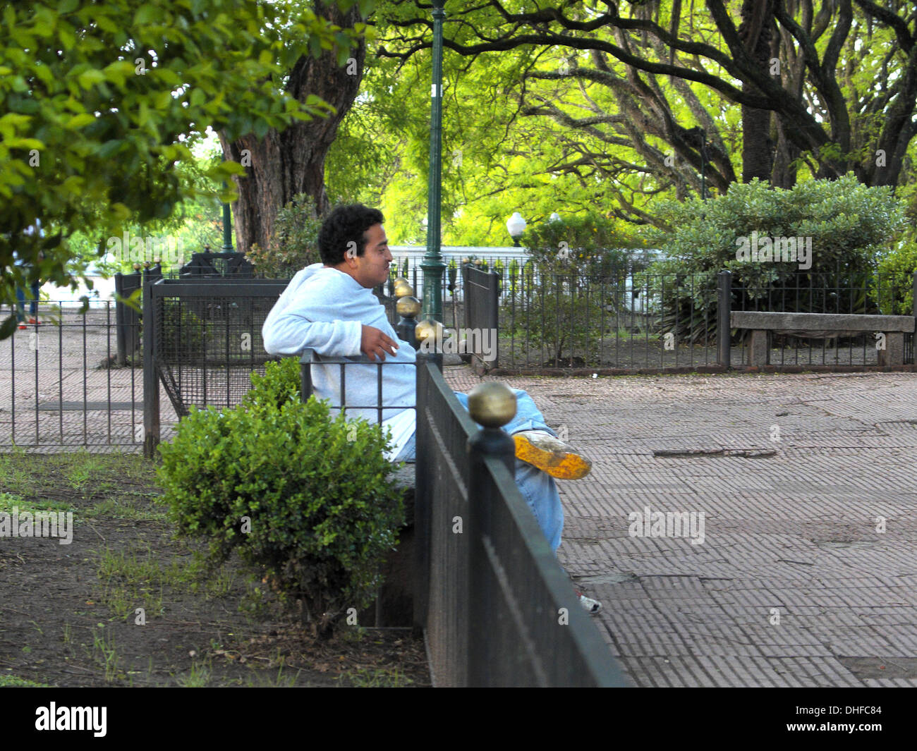 boy sitting on the plaza Stock Photo - Alamy
