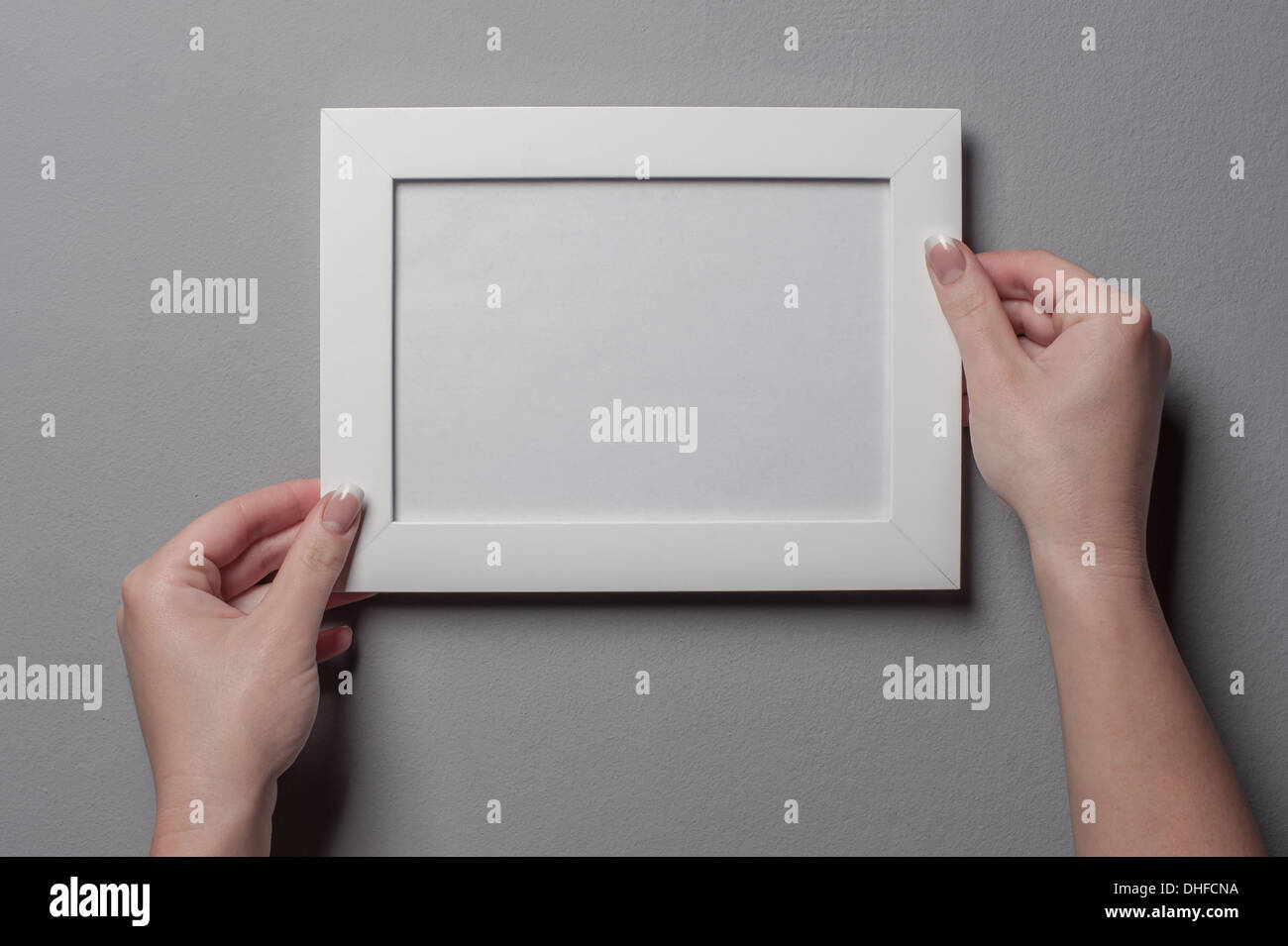 Woman holding empty picture frame hi-res stock photography and images ...