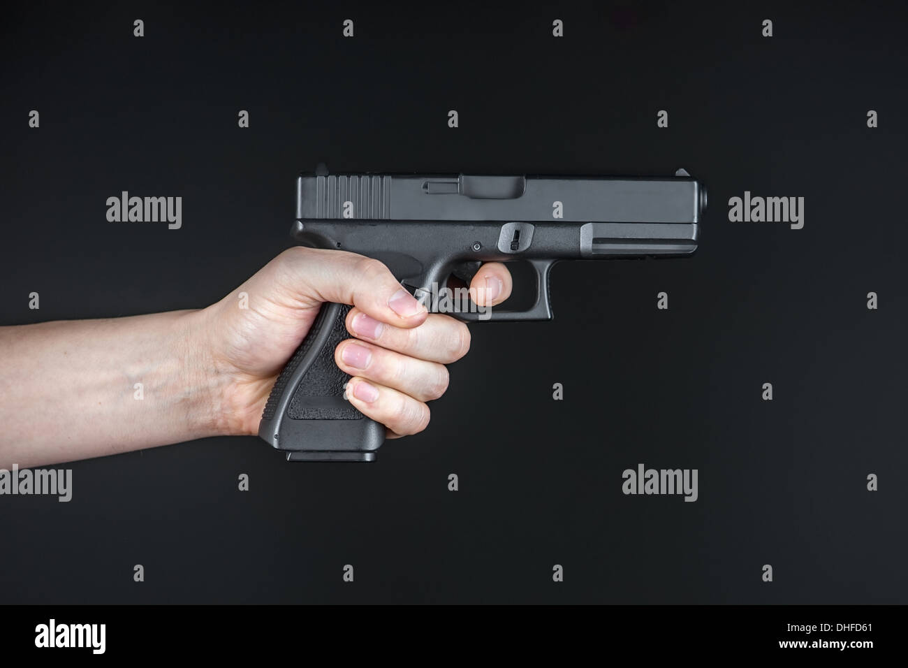 handgun in men hand closeup Stock Photo - Alamy