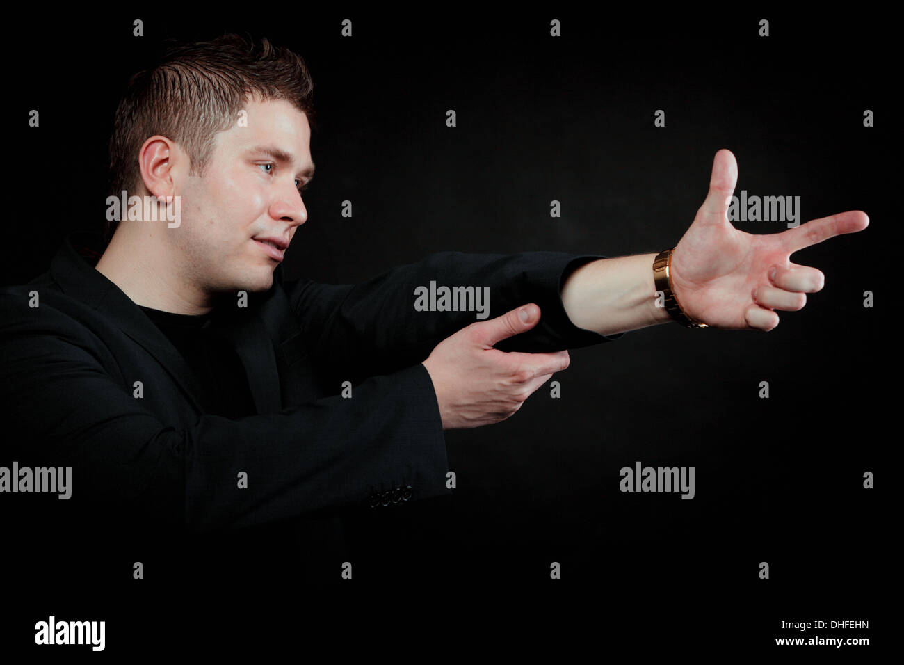 Man pointing a finger towards Stock Photo - Alamy